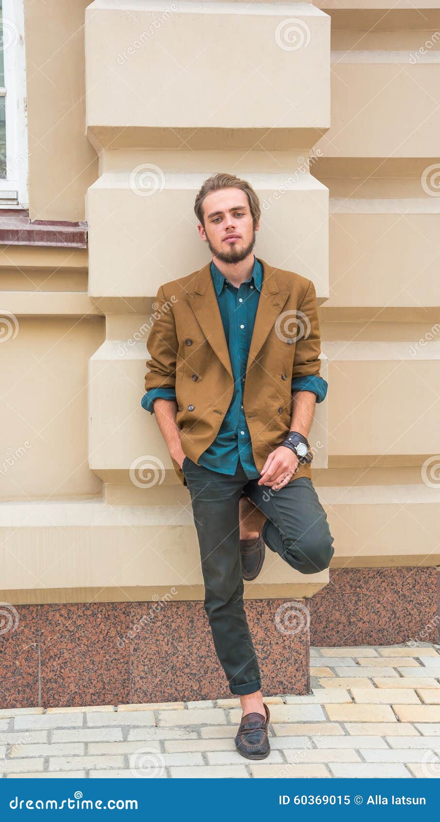 A Young Man is Standing Near a Wall Stock Image - Image of thinking ...
