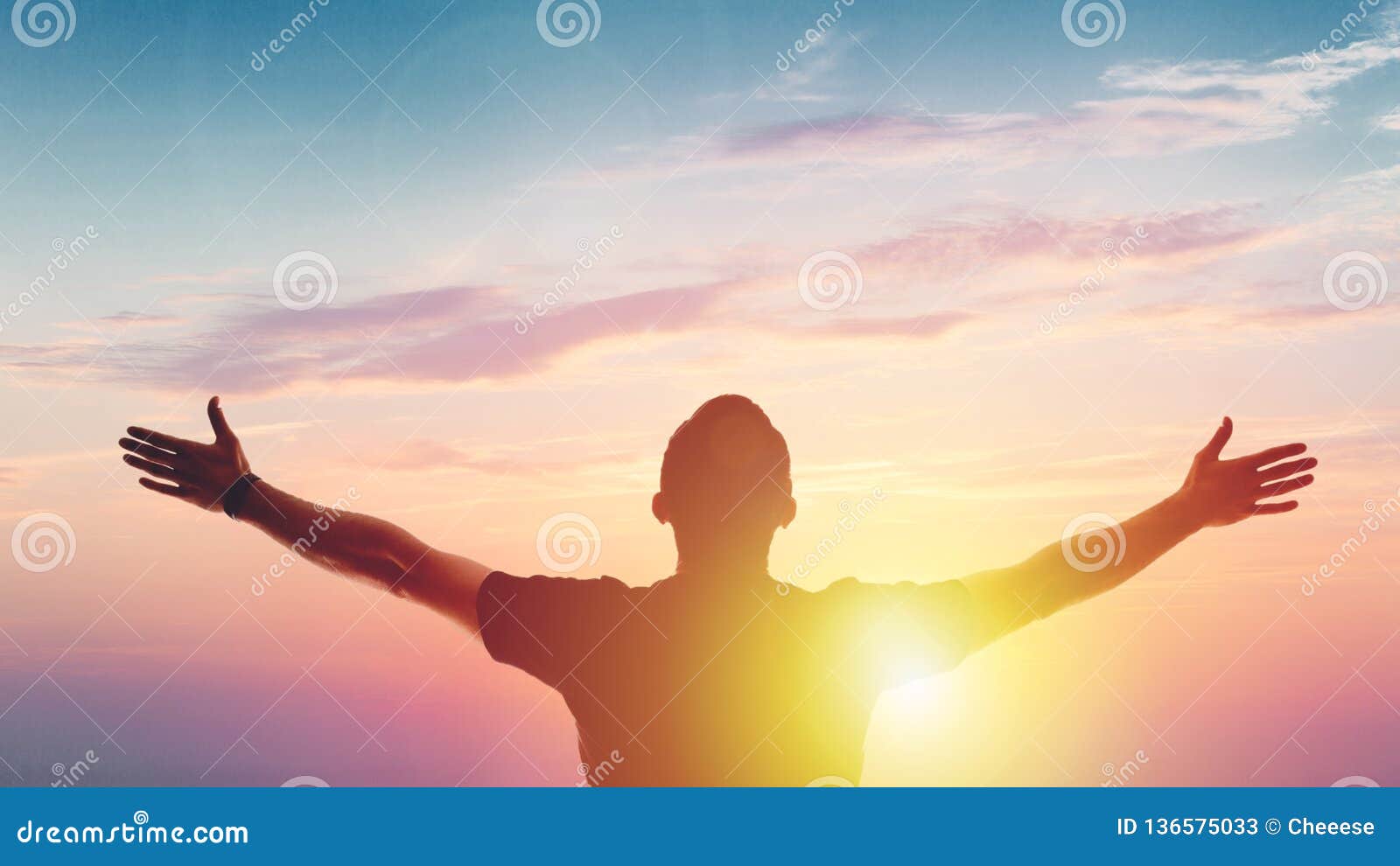 Young Man Standing Outstretched at Sunset. Victory Stock Image - Image ...