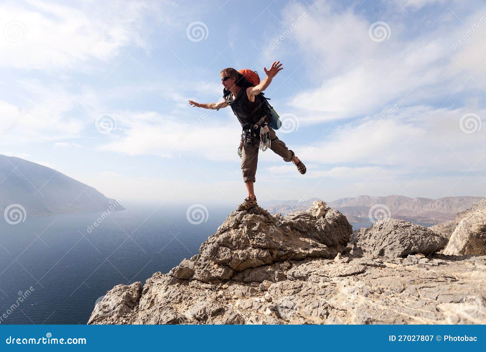 Young Man Standing on a Rock Stock Image - Image of landscape, stone ...