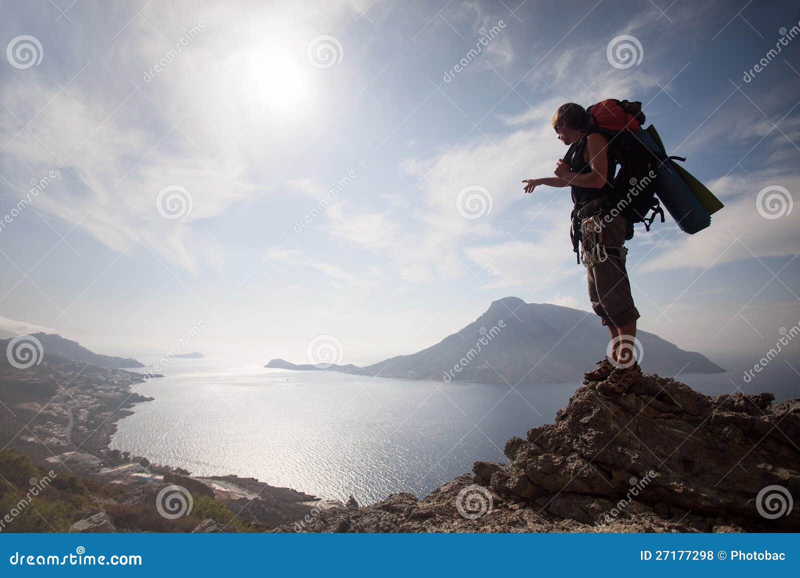 Young Man Standing on a Rock Stock Photo - Image of male, concept: 27177298