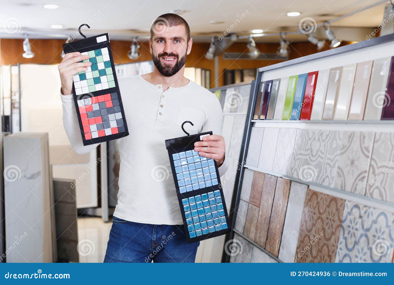 Young Man Standing with Sample of Ceramic Tile Stock Photo - Image of ...