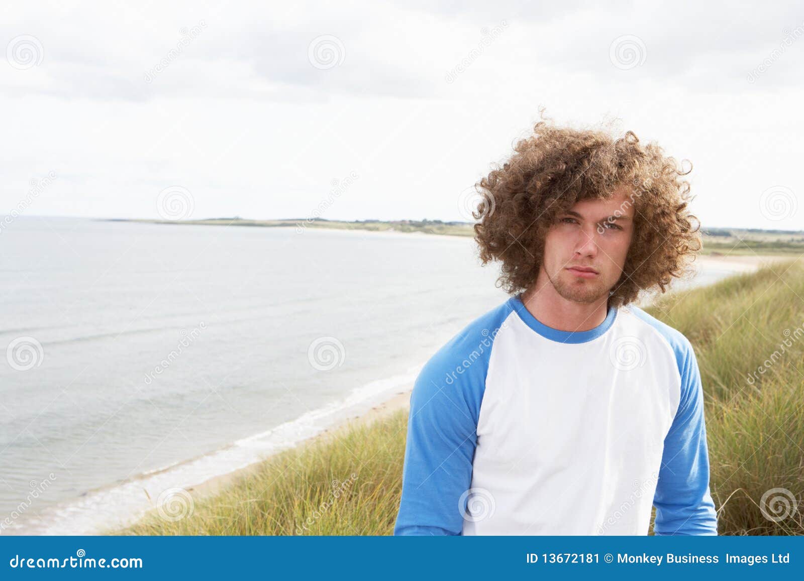 Young Man Standing in Sand Dunes Stock Image - Image of copy, fall ...