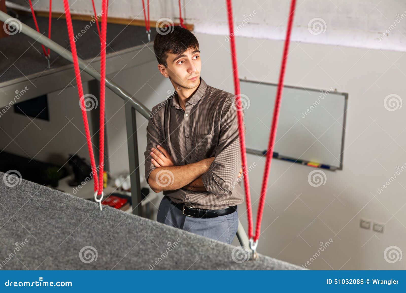 Young Man Standing on the Steps in Office Stock Photo - Image of office ...