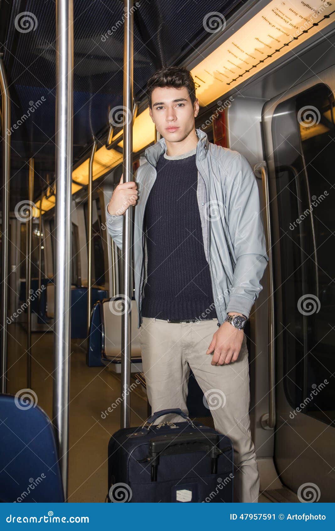 Young Man Standing in Subway Train Going on Vacation Stock Image ...