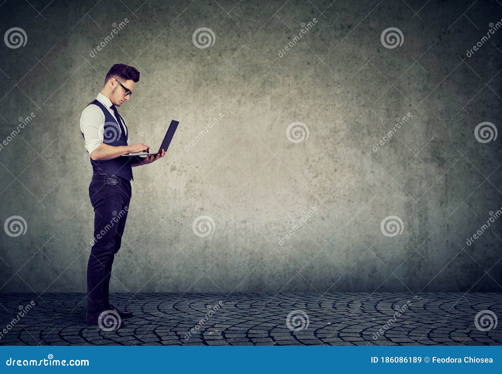 Man Standing Using Laptop Computer Stock Image - Image of entrepreneur ...