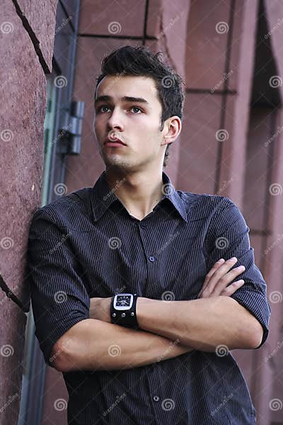 Young Man Standing and Waiting Stock Photo - Image of outside, clocks ...