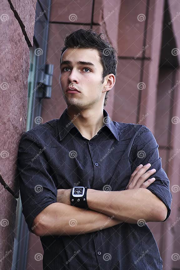 Young Man Standing and Waiting Stock Photo - Image of outside, clocks ...