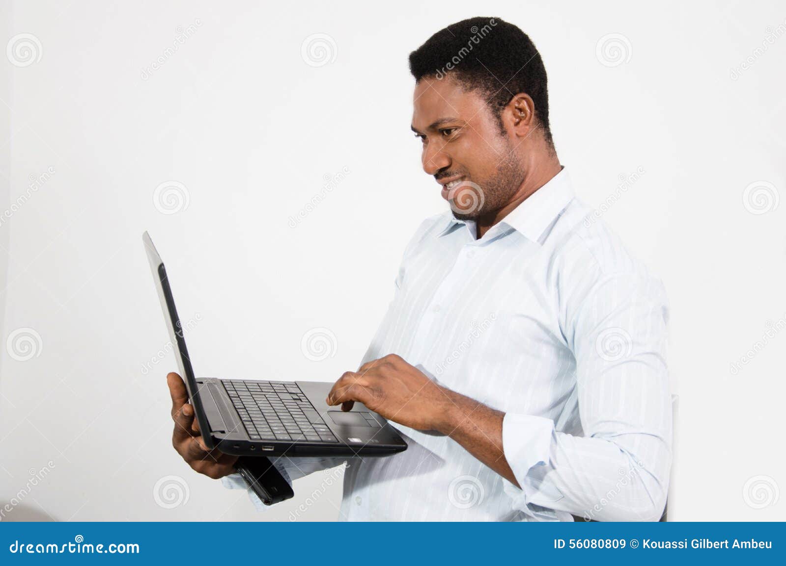 Young Man Standing and Working with His Laptop. Stock Image - Image of ...