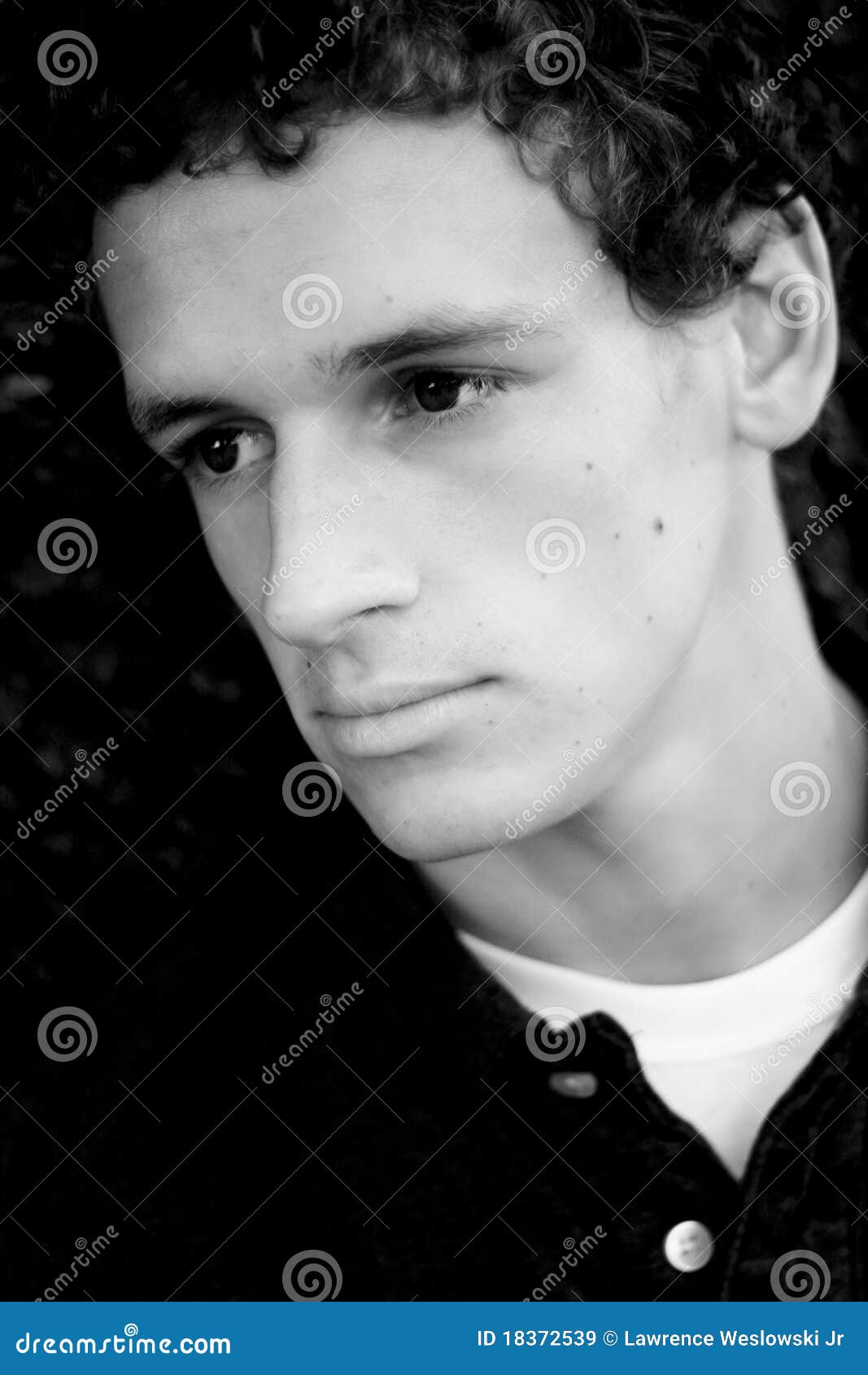 Young Man Stands Against Tree Stock Image - Image of alone, adult: 18372539