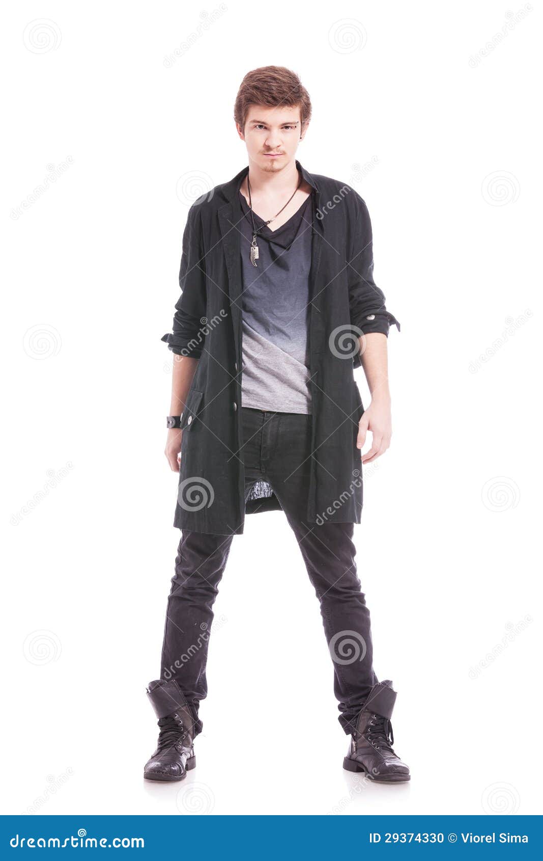 Young man stands in studio stock photo. Image of male - 29374330
