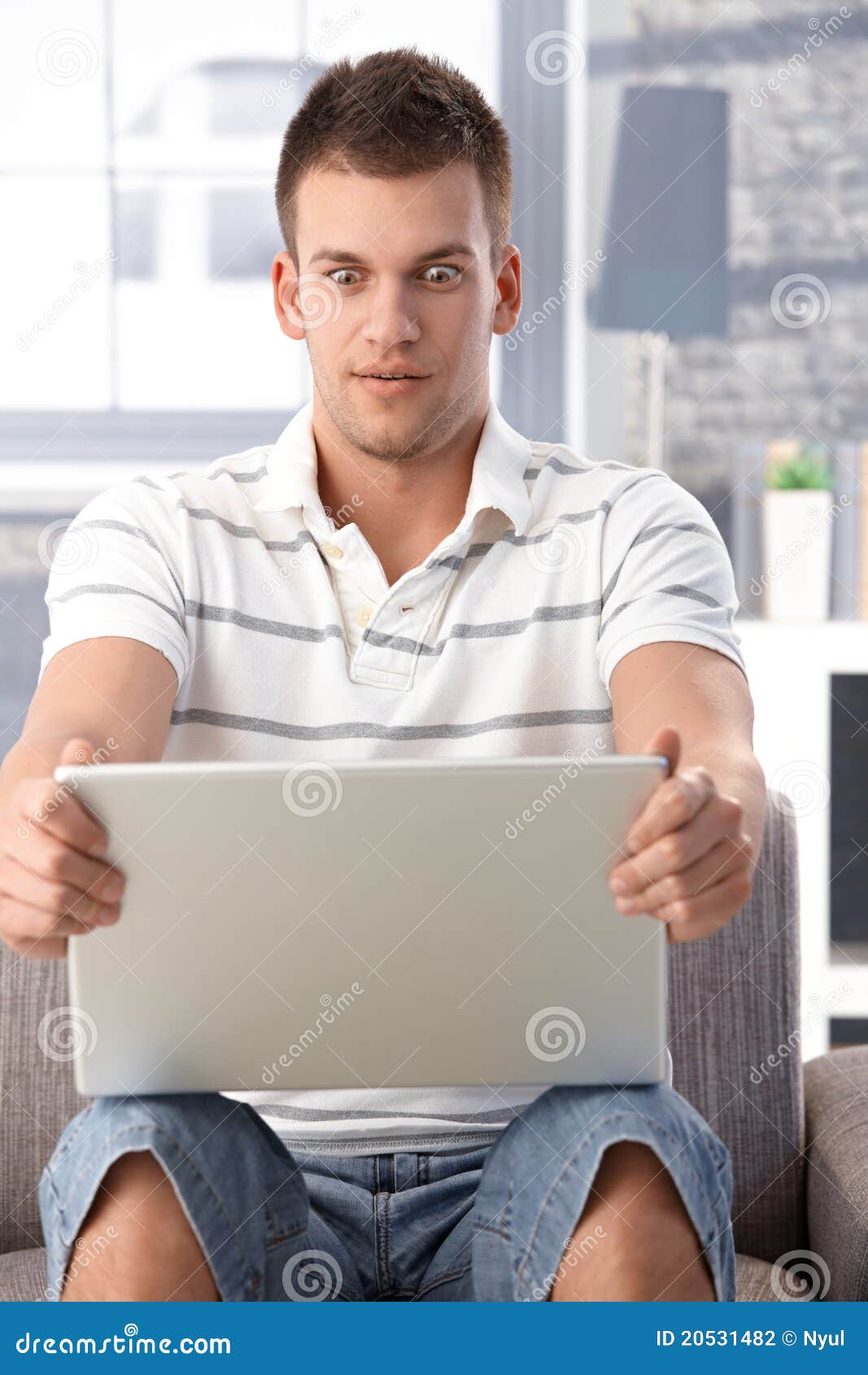 Young Man Staring at Laptop Screen Horrified Stock Photo - Image of ...