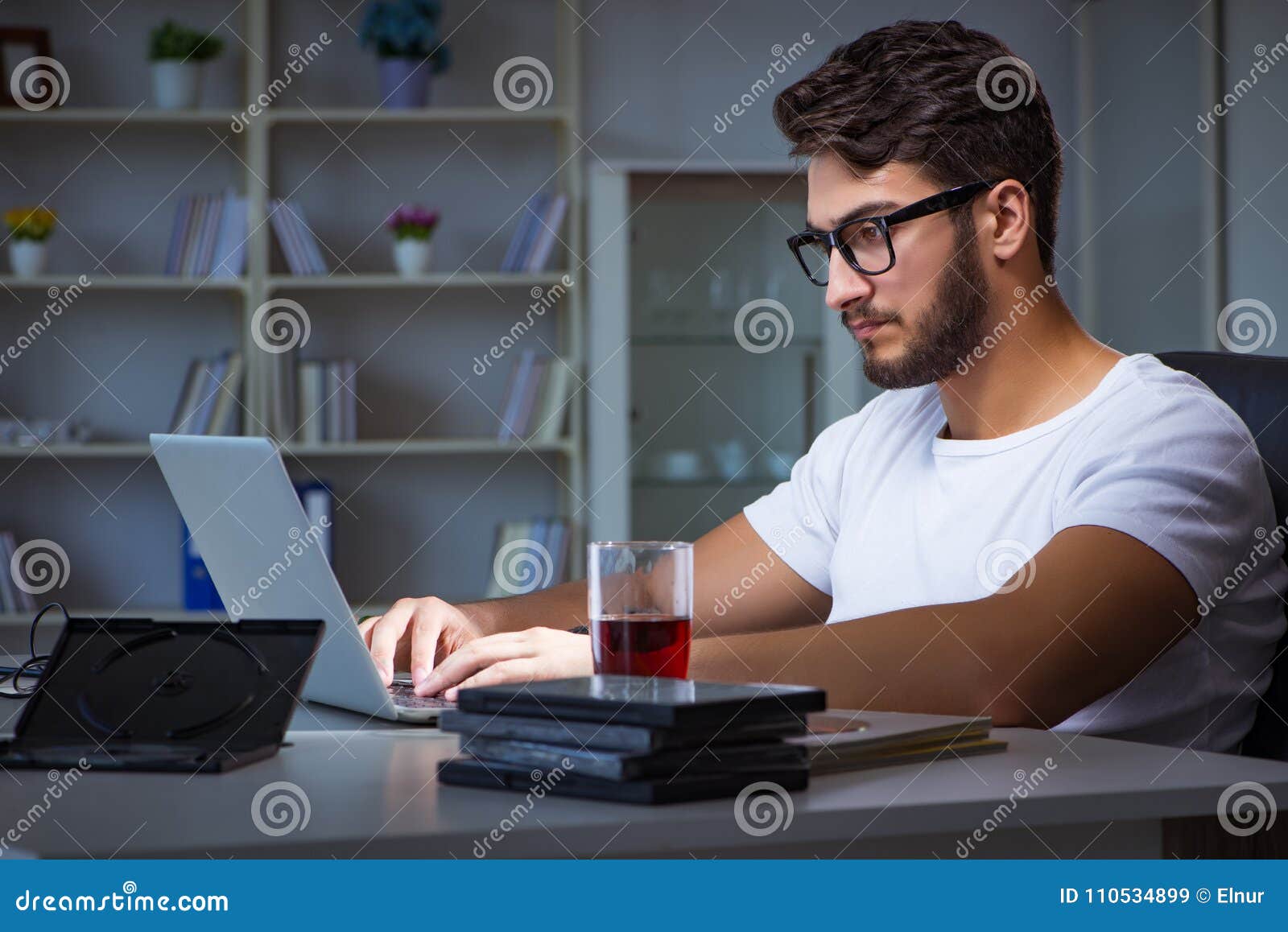 The Young Man Staying Late in Office To Do Overtime Work Stock Image ...