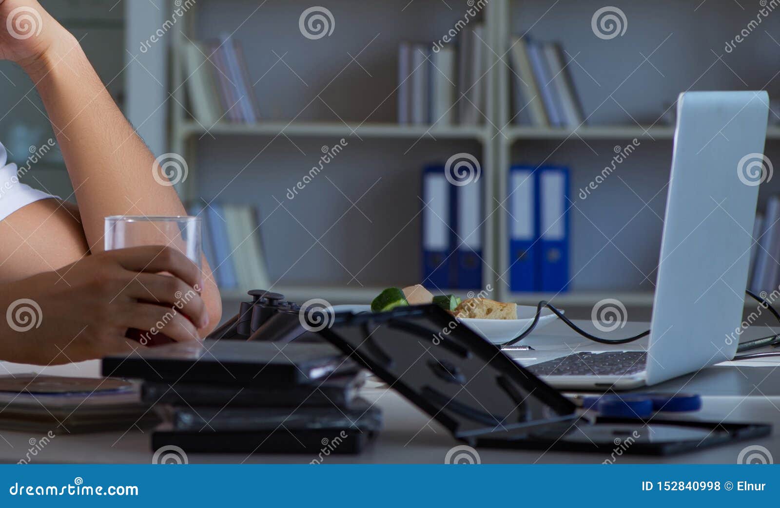 Young Man Staying Late in Office To Do Overtime Work Stock Photo ...