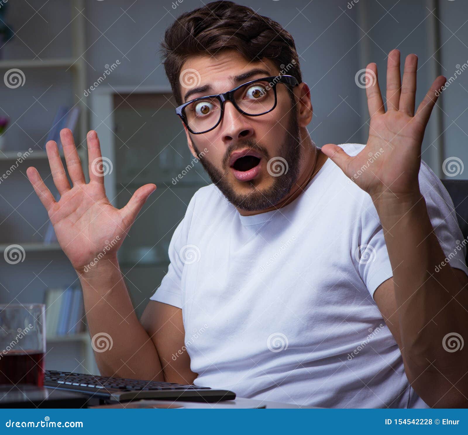 Young Man Staying Late in Office To Do Overtime Work Stock Photo ...