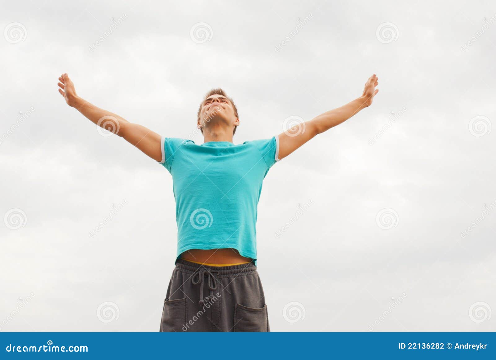 Young Man Staying with Raised Hands Stock Photo - Image of solitude ...