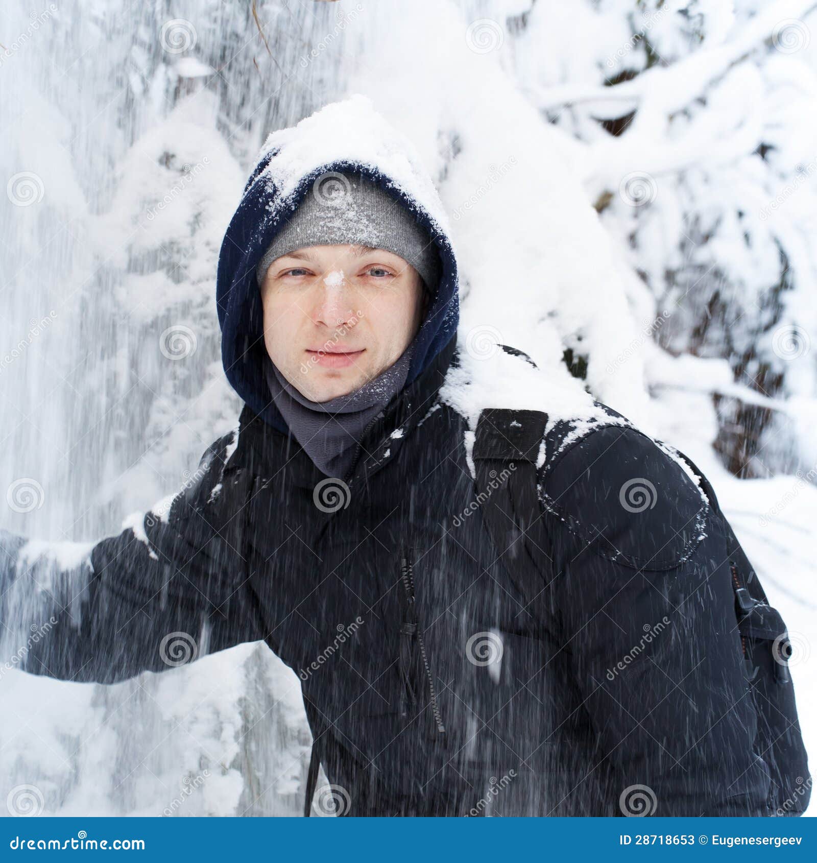 Young Man Stays and Smiles Under Falling Snow Stock Image - Image of ...