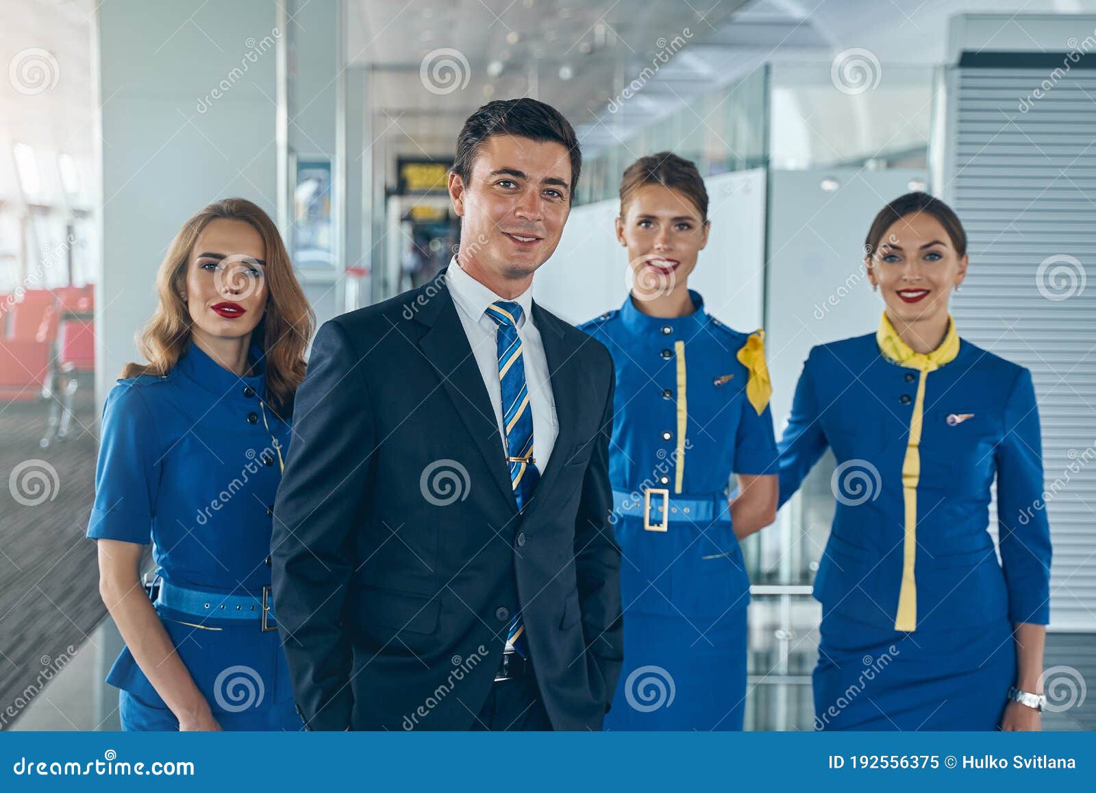 Young Man and Stewardesses Smiling at the Camera Stock Image - Image of ...
