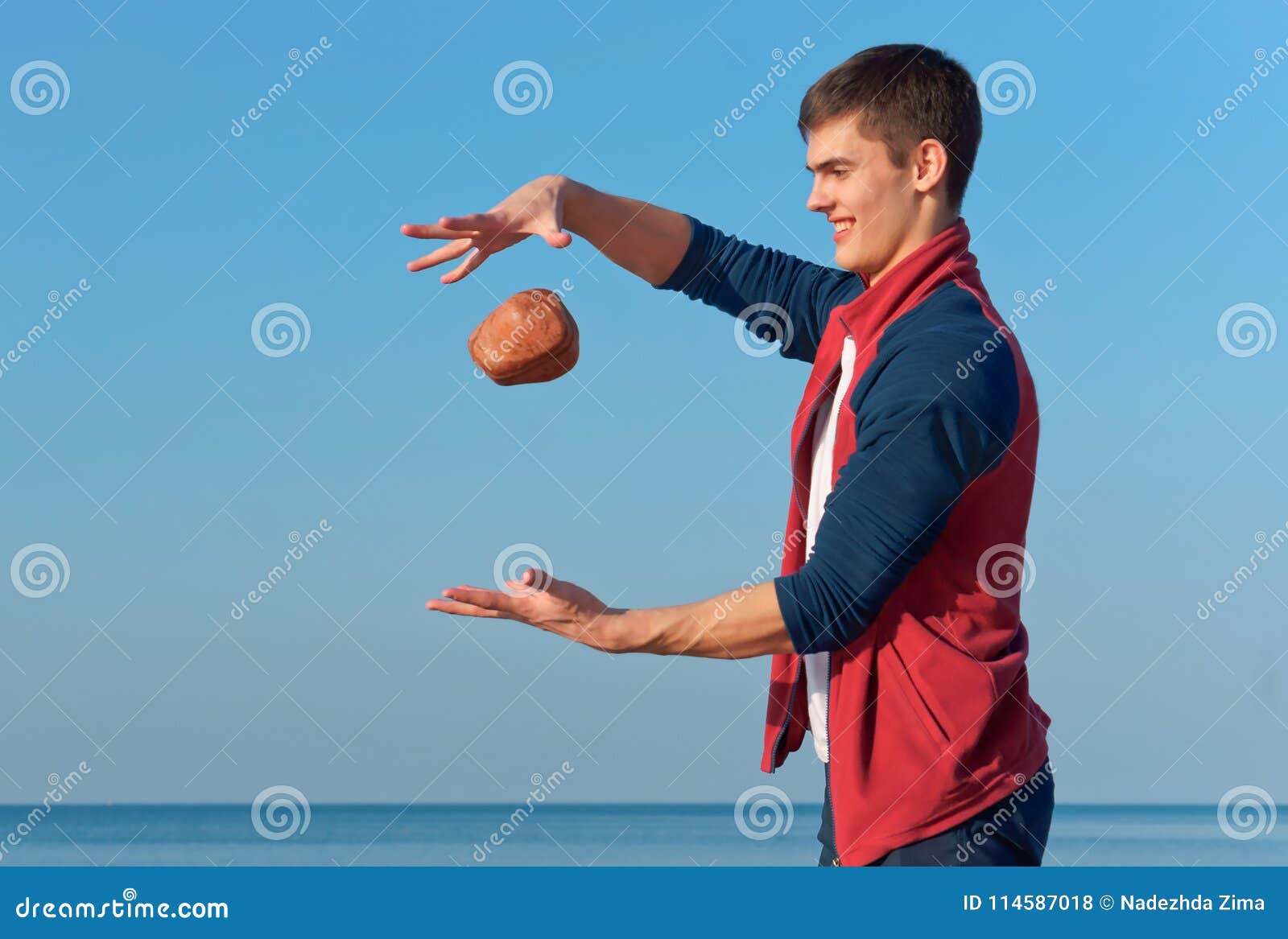 A Young Man with a Stone, Levitation, a Young Man Throws Stones Stock ...