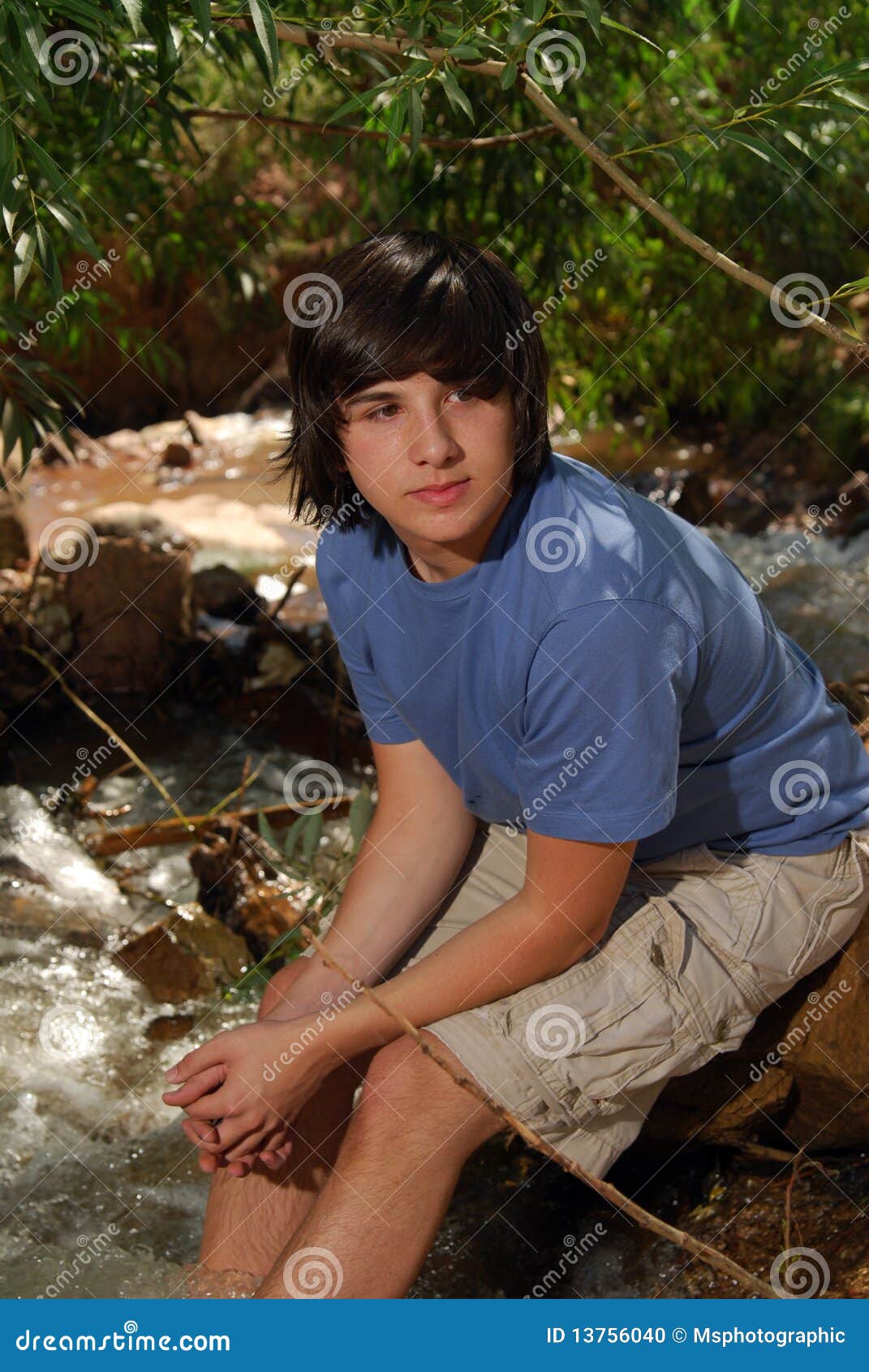 Young man in a stream stock photo. Image of male, adolescent - 13756040