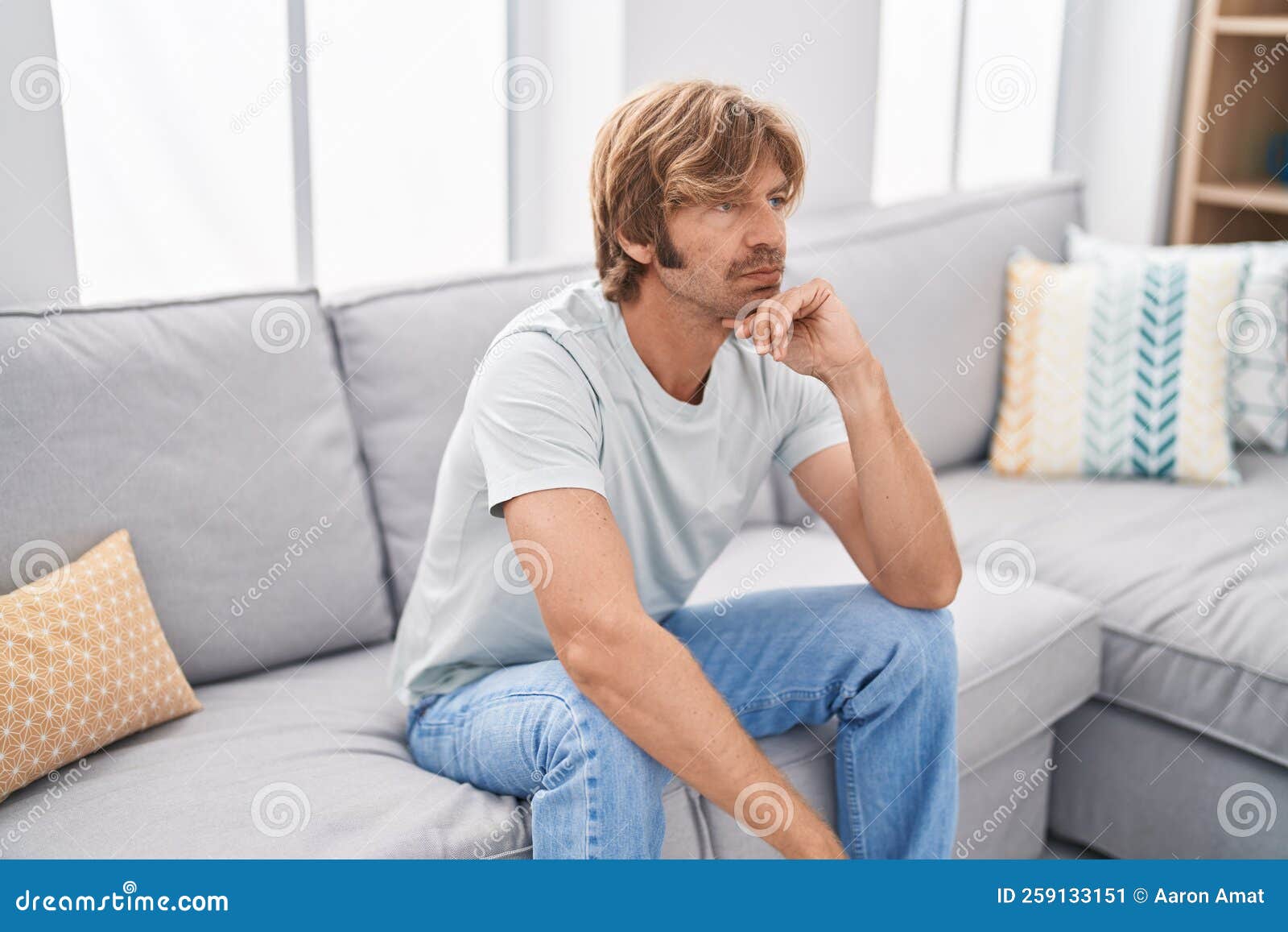 Young Man Stressed Sitting on Sofa at Home Stock Image - Image of ...