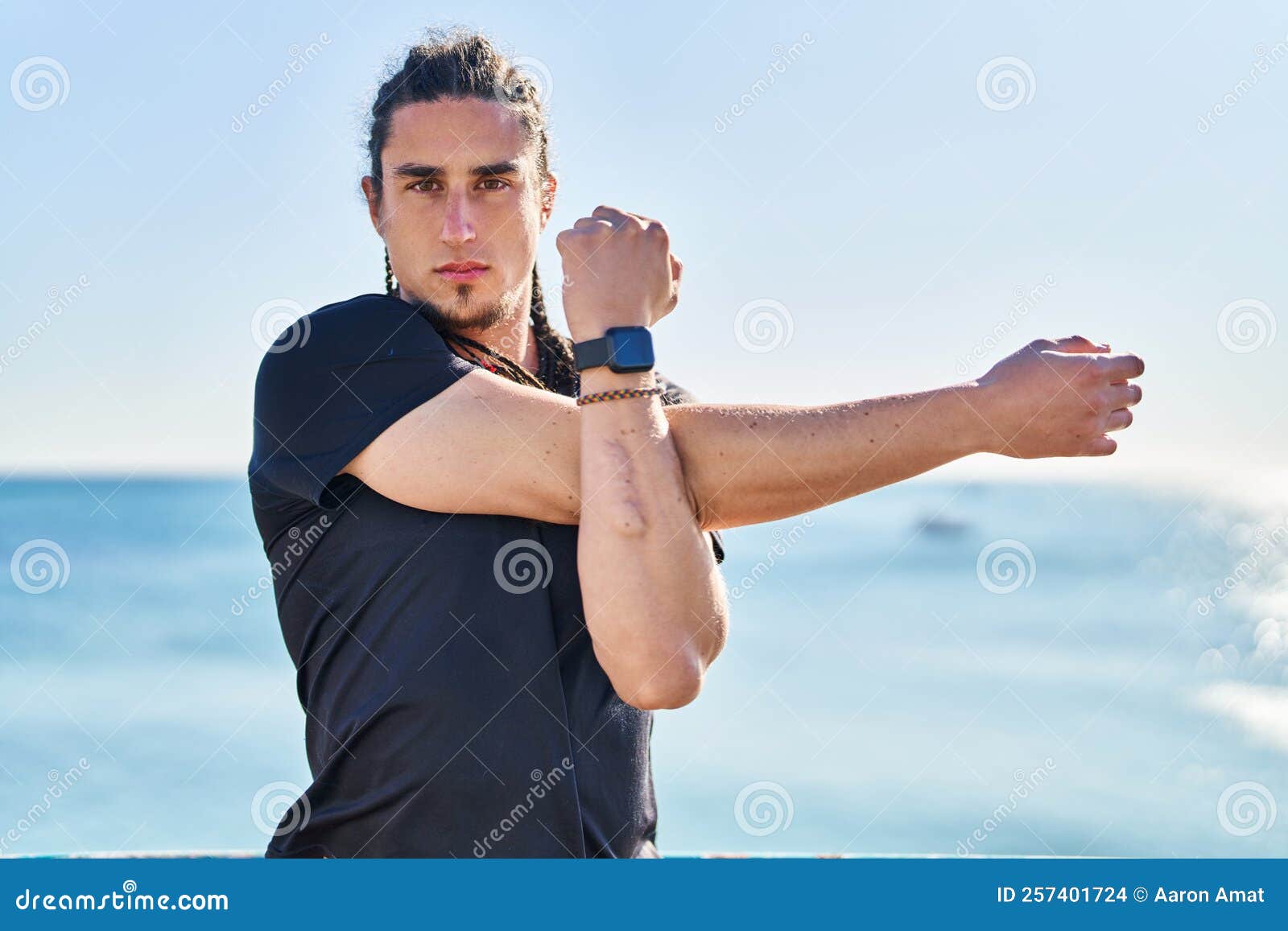 Young Man Stretching Arms at Seaside Stock Photo - Image of stretching ...