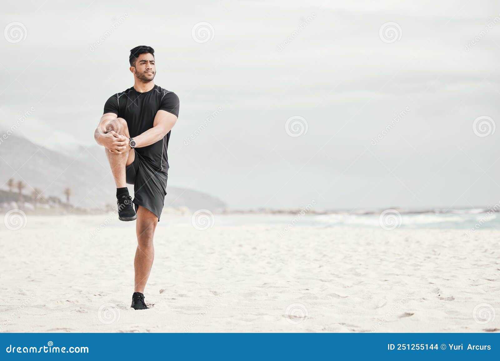 Stretch Your Day by Starting it with a Workout. a Young Man Stretching ...