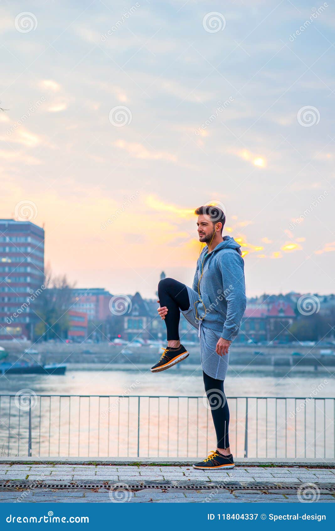 Young man stretching stock image. Image of riverside - 118404337