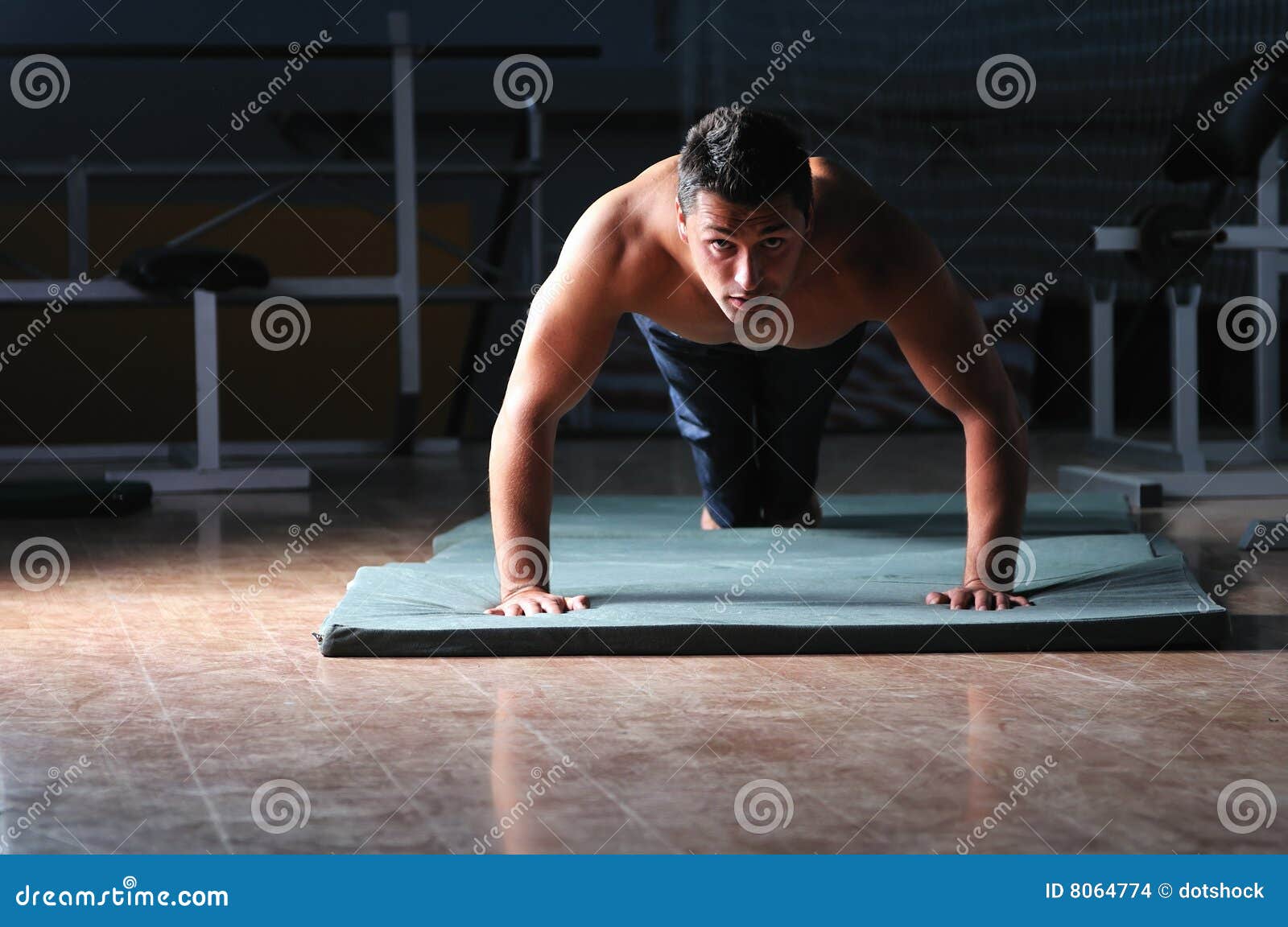 Young Man with Strong Arms Working Out in Gym Stock Photo - Image of ...