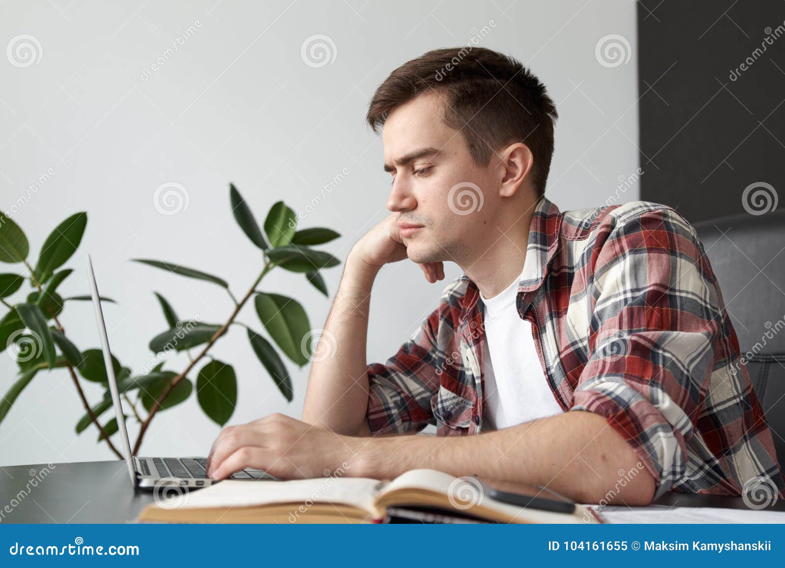 A Young Man, a Student Doing Homework in a Thoughtful Expression Stock ...