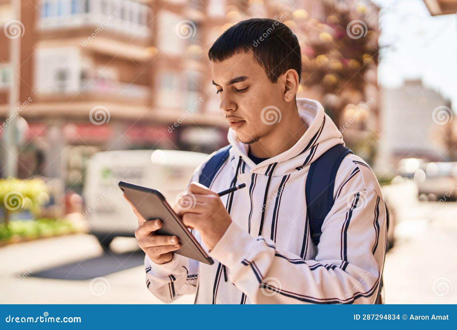 Young Man Student Drawing on Touchpad Standing at Street Stock Photo ...
