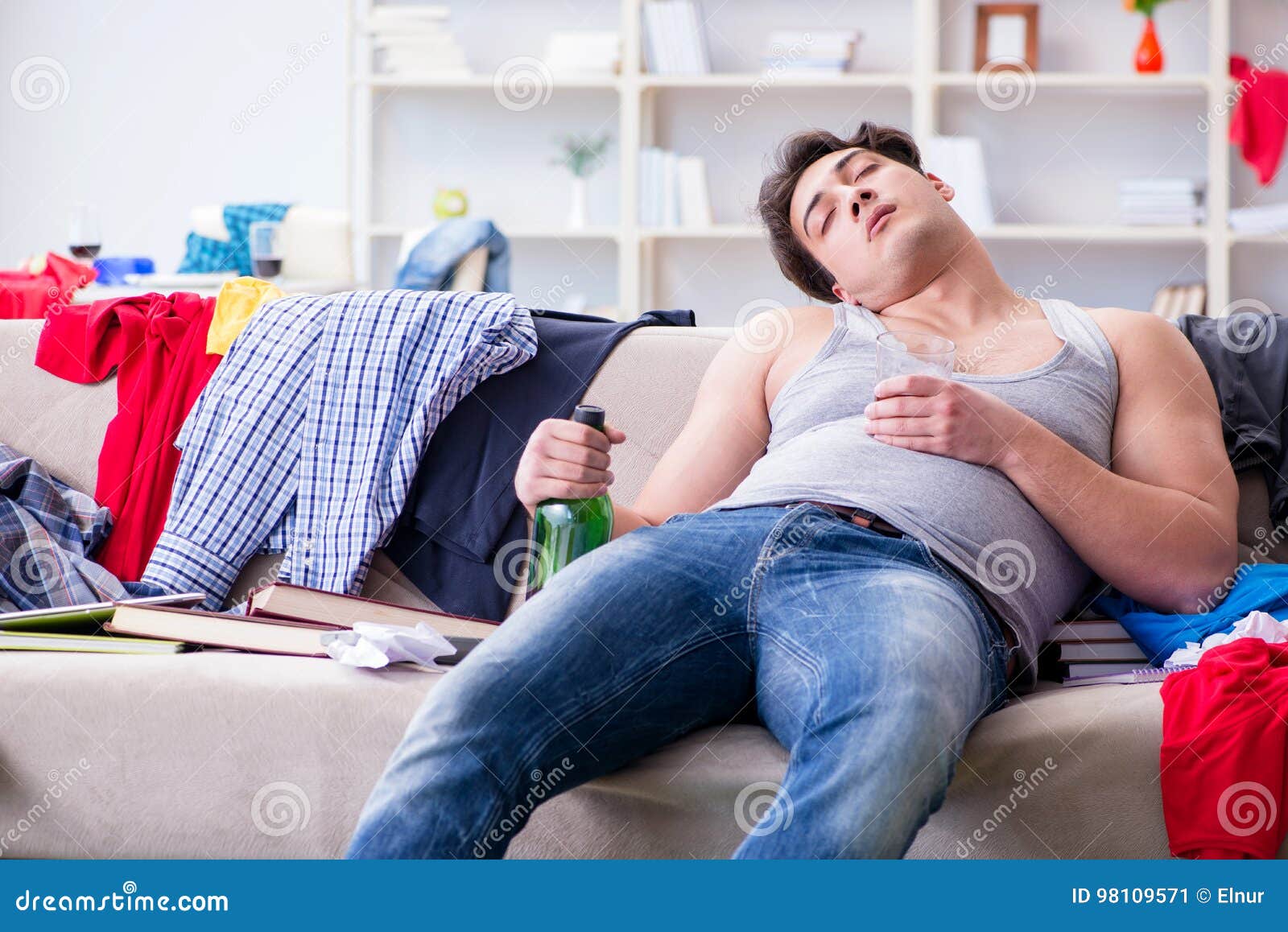The Young Man Student Drunk Drinking Alcohol in a Messy Room Stock ...