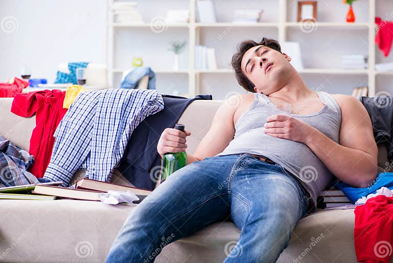 The Young Man Student Drunk Drinking Alcohol in a Messy Room Stock ...