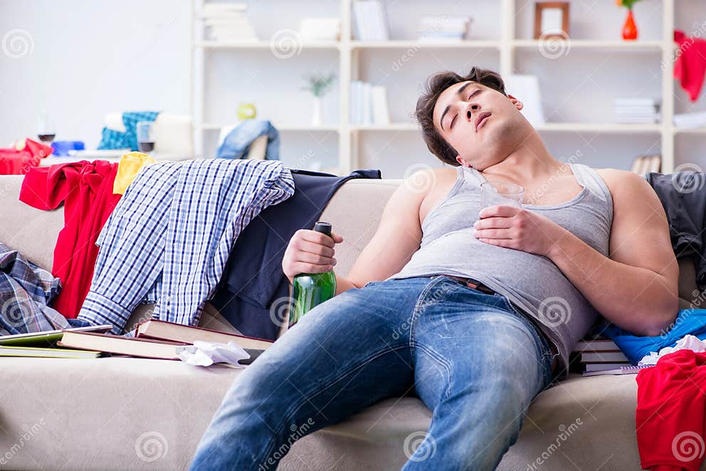 The Young Man Student Drunk Drinking Alcohol in a Messy Room Stock ...
