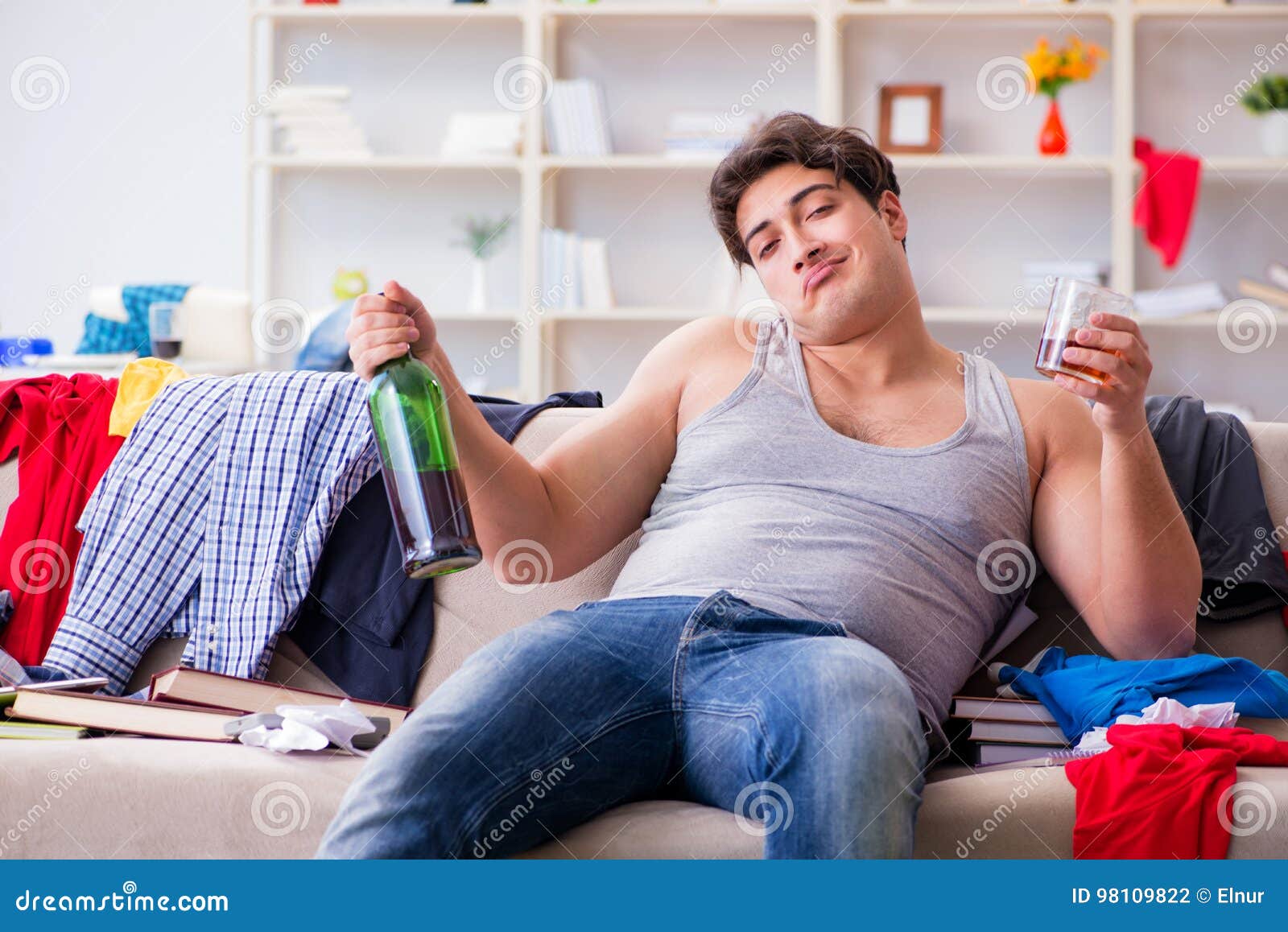 The Young Man Student Drunk Drinking Alcohol in a Messy Room Stock ...