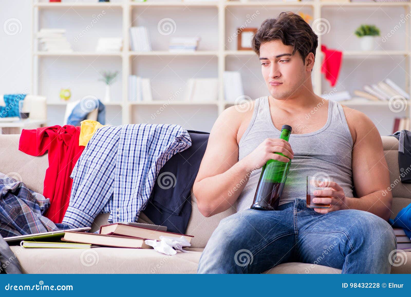 The Young Man Student Drunk Drinking Alcohol in a Messy Room Stock ...