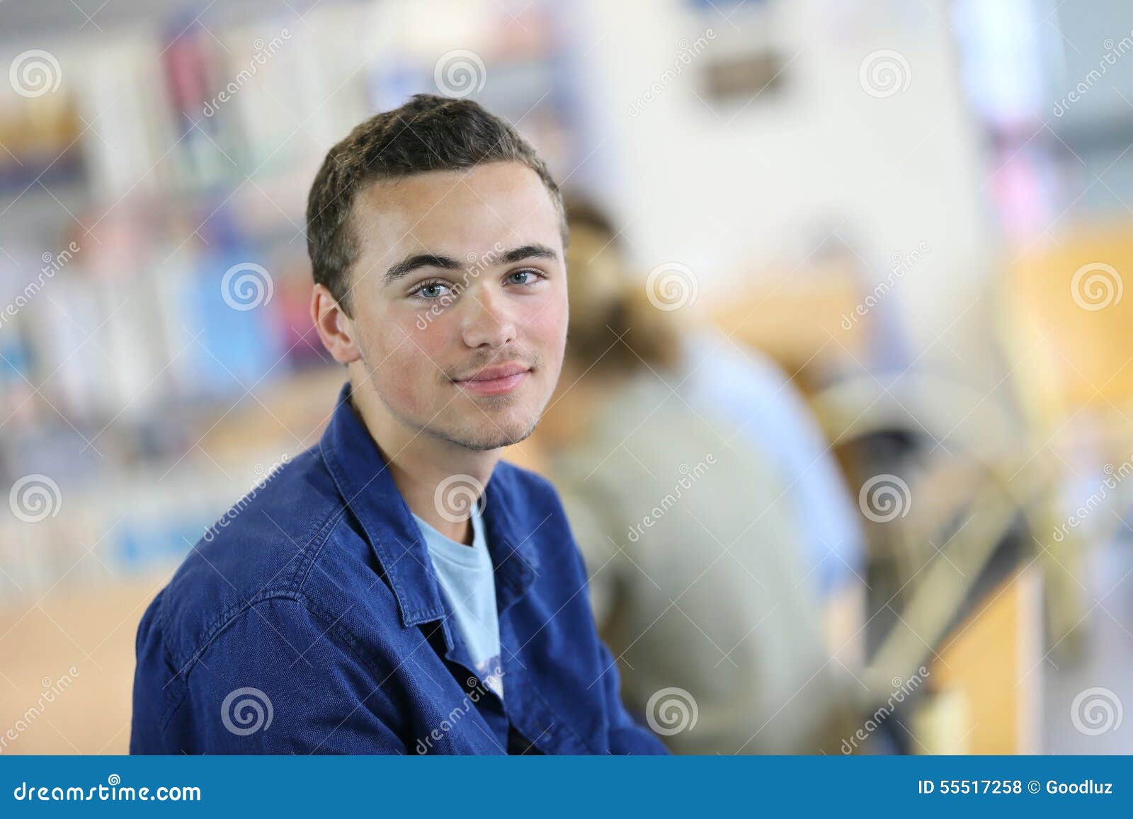 Young Man Student Sitting in Library Stock Photo - Image of teen, smile ...