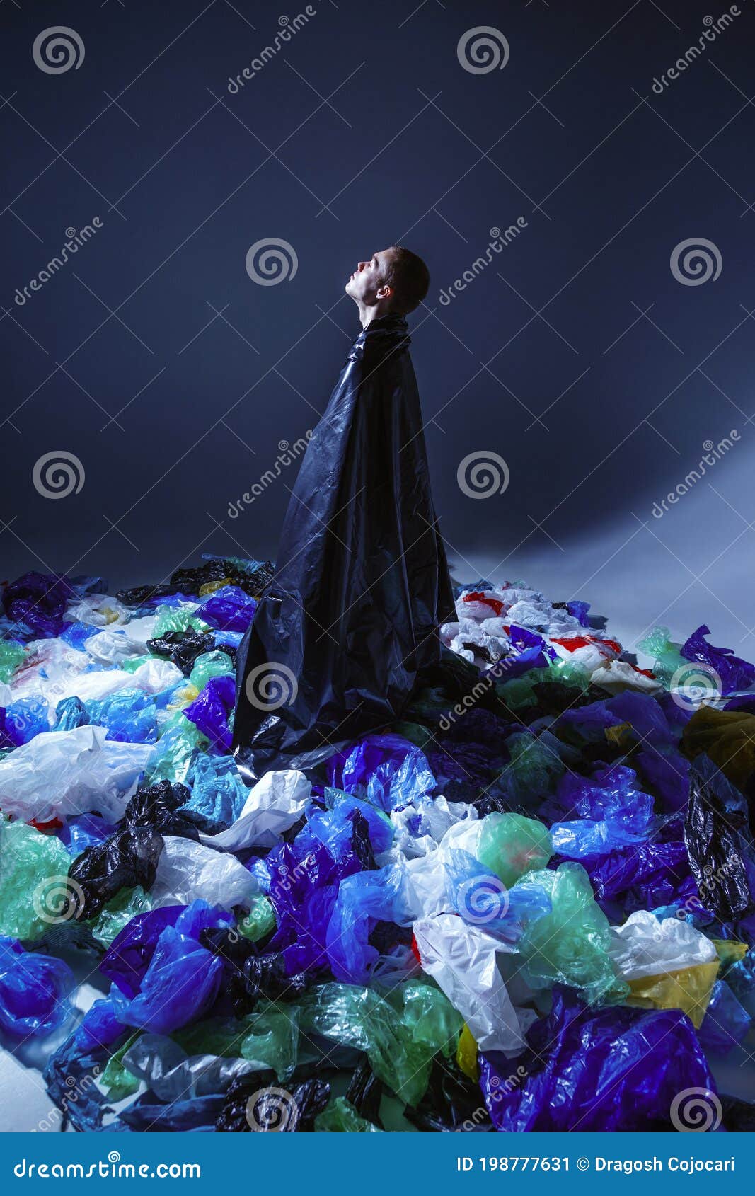 Young Man in Studio, Surrounded by Empty Plastic Garbage Bags Stock ...