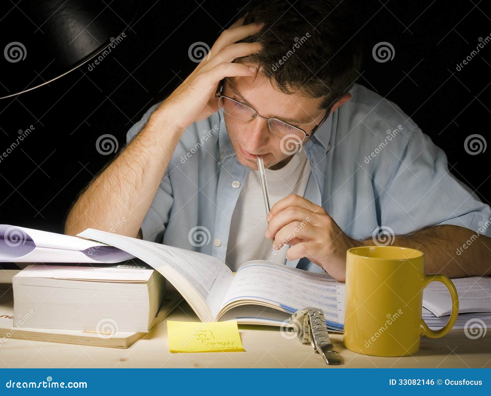 Young Man Studying at Night Stock Photo - Image of glasses, male: 33082146