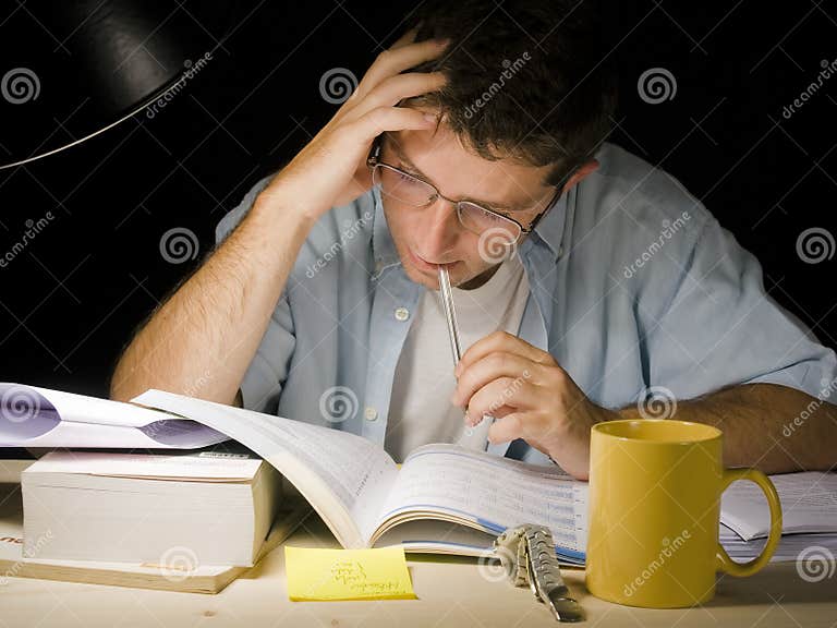 Young Man Studying at Night Stock Photo - Image of glasses, male: 33082146