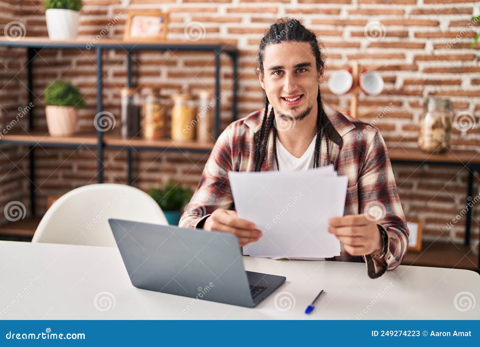 Young Man Studying Sitting on Table at Home Stock Image - Image of ...