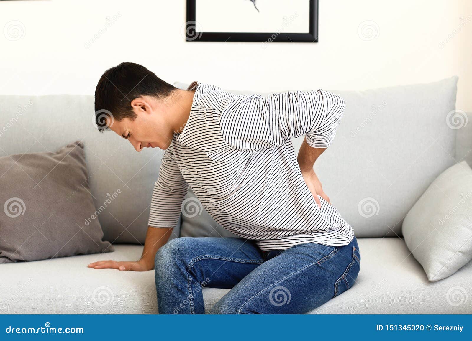 Young Man Suffering from Back Pain at Home Stock Photo - Image of hurt ...