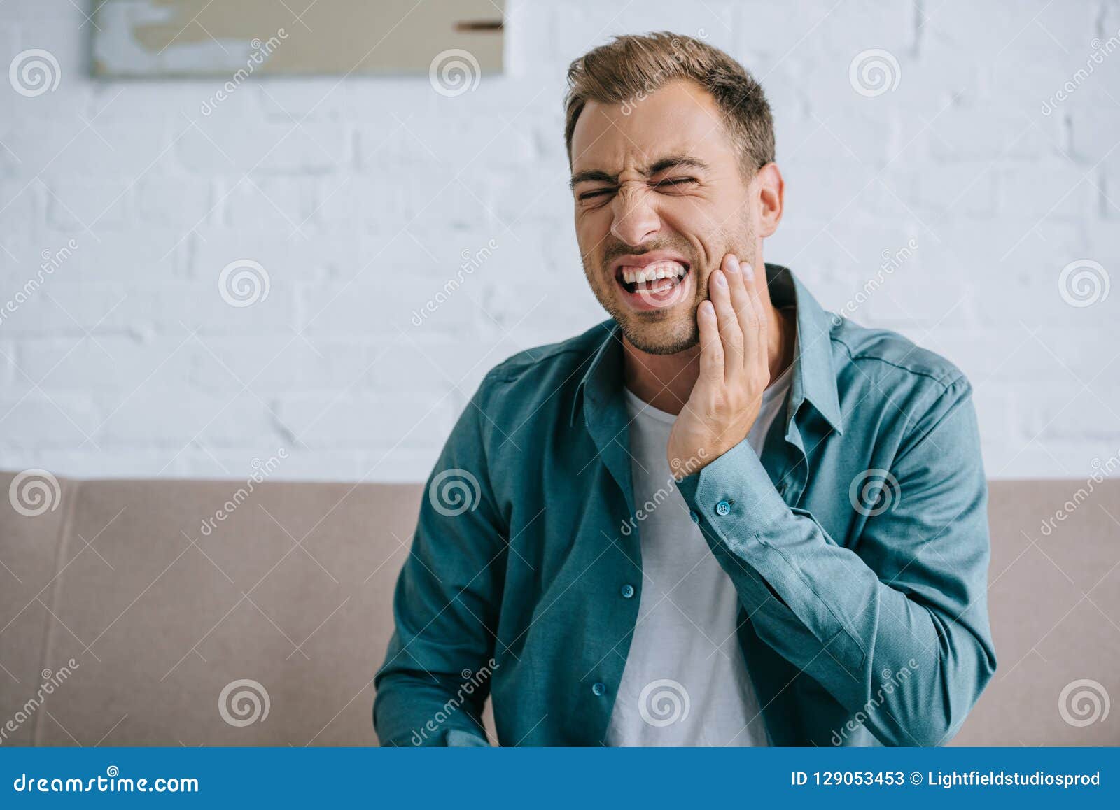 Young Man Suffering from Tooth Pain Stock Image - Image of indoors ...