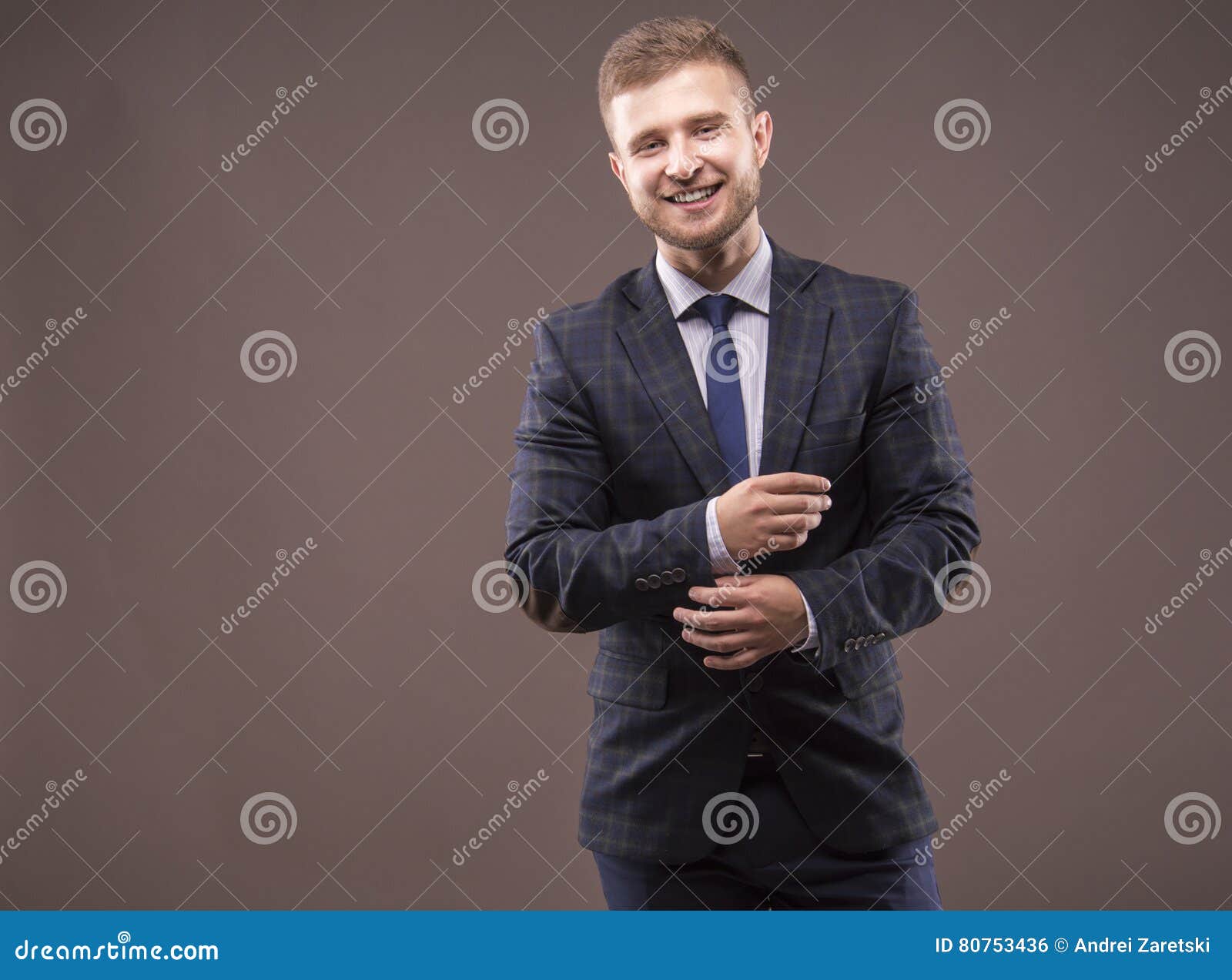 Young Man in Suit Adjusts His Cuffs Stock Photo - Image of expression ...