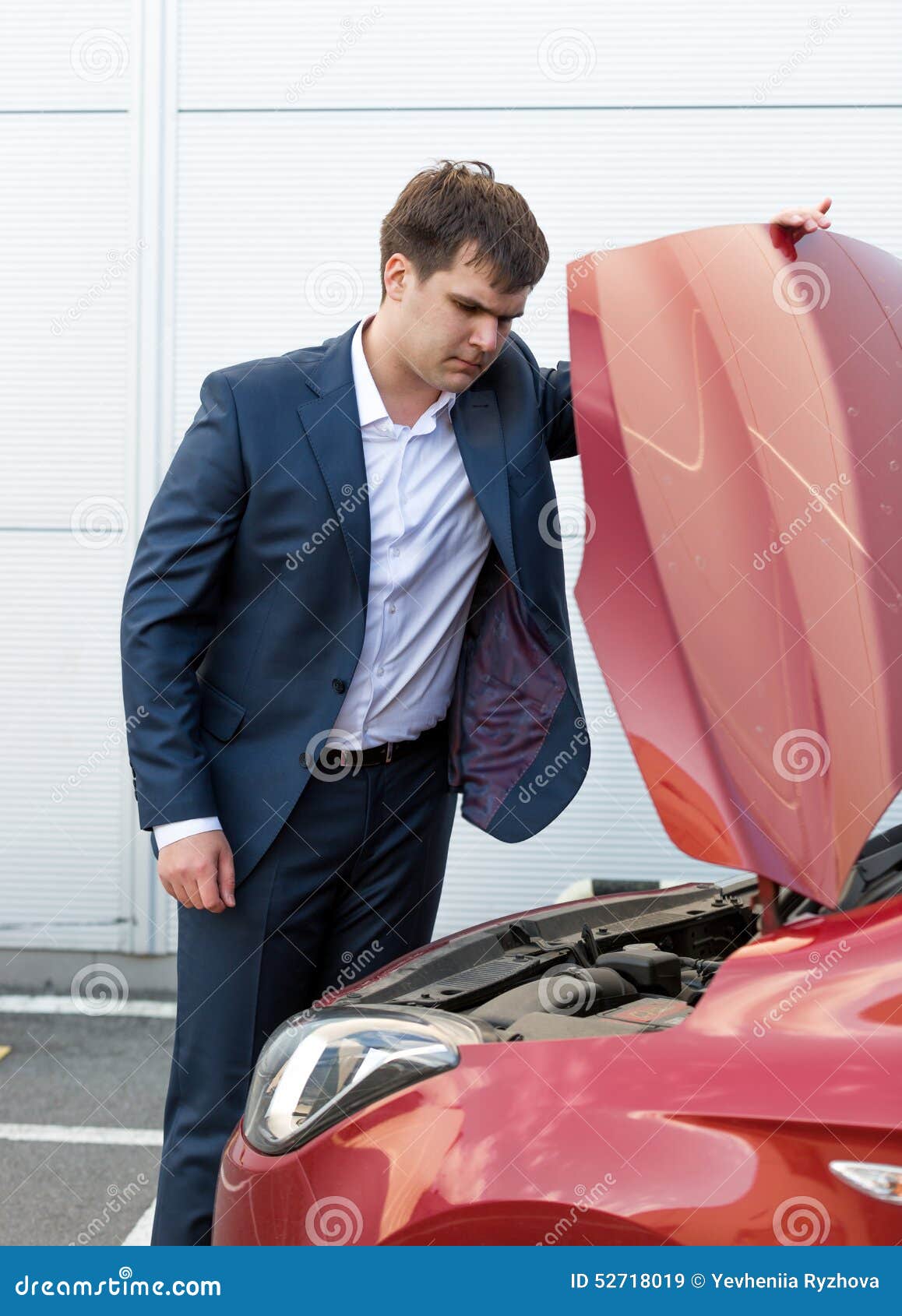Young Man in Suit Looking Under the Hood of Broken Car Stock Image ...