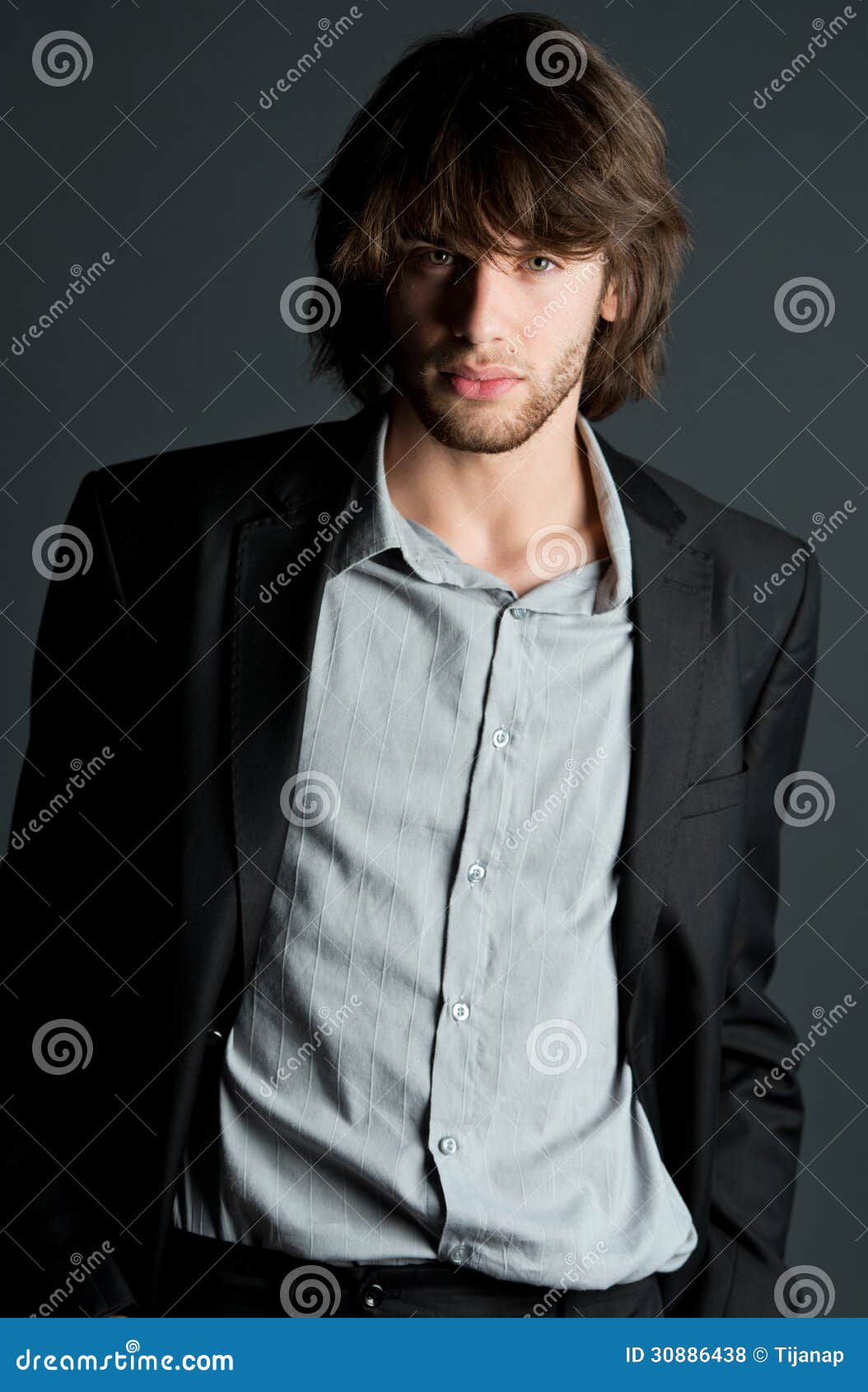 Young man in suit portrait stock photo. Image of gray - 30886438