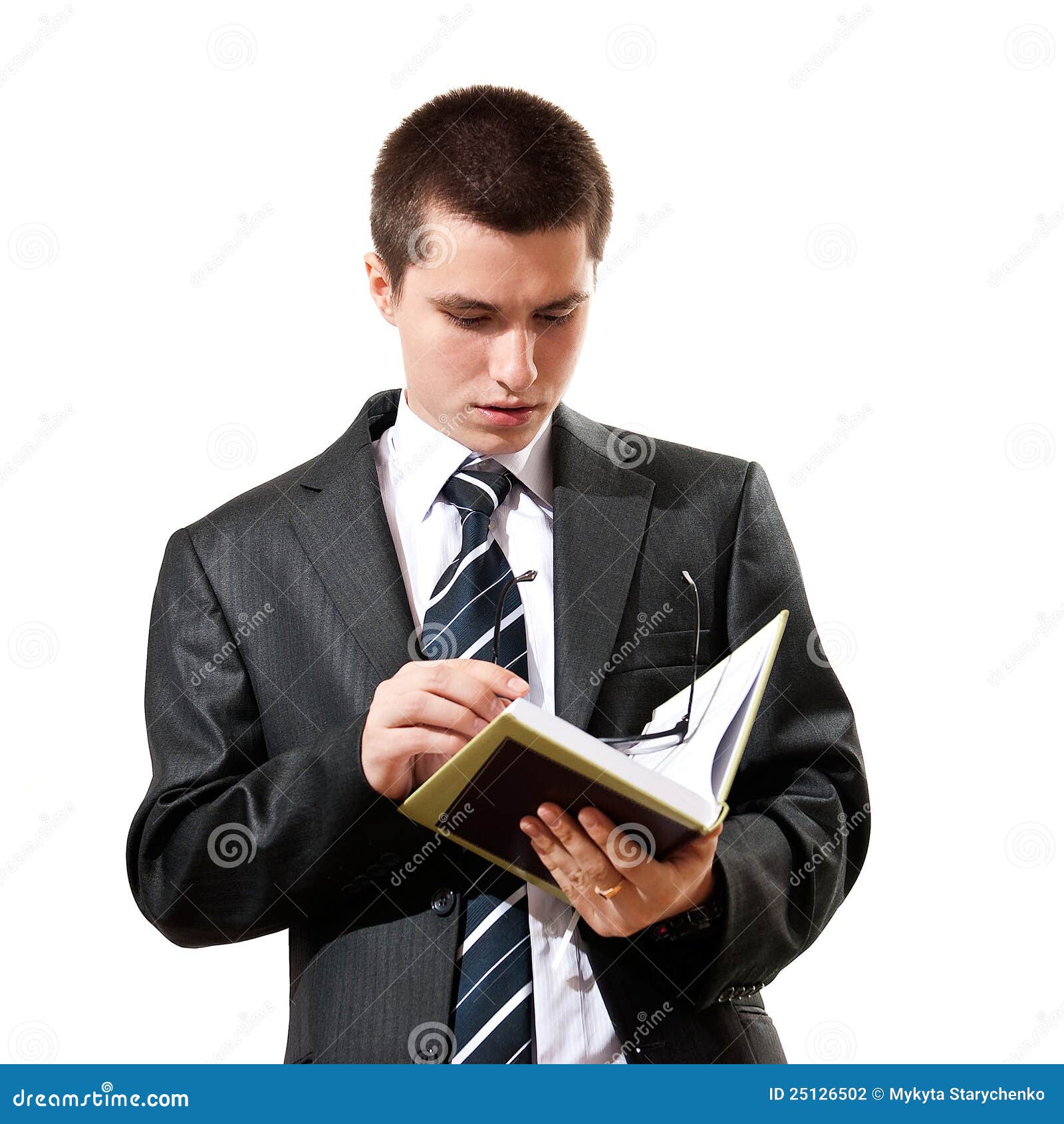 Young Man in a Suit Reading a Book Stock Photo - Image of latino ...