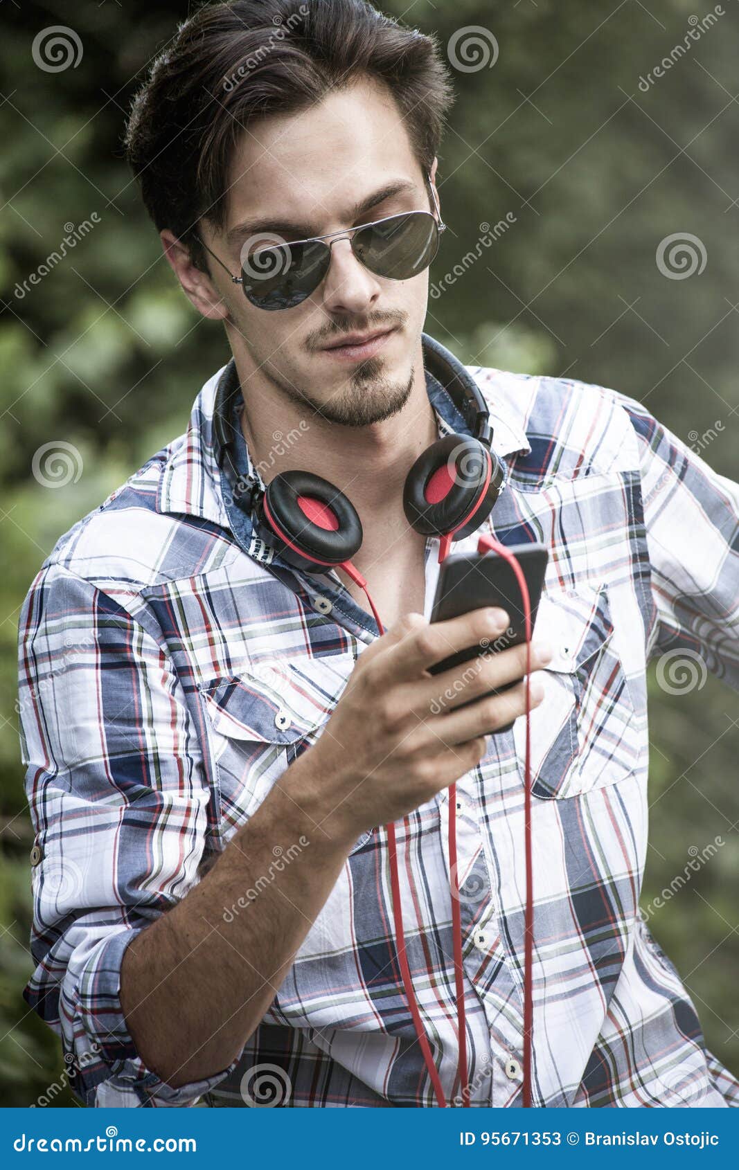 Young Man With Sunglasses Smartphone And Headphones Outdoor Port Stock