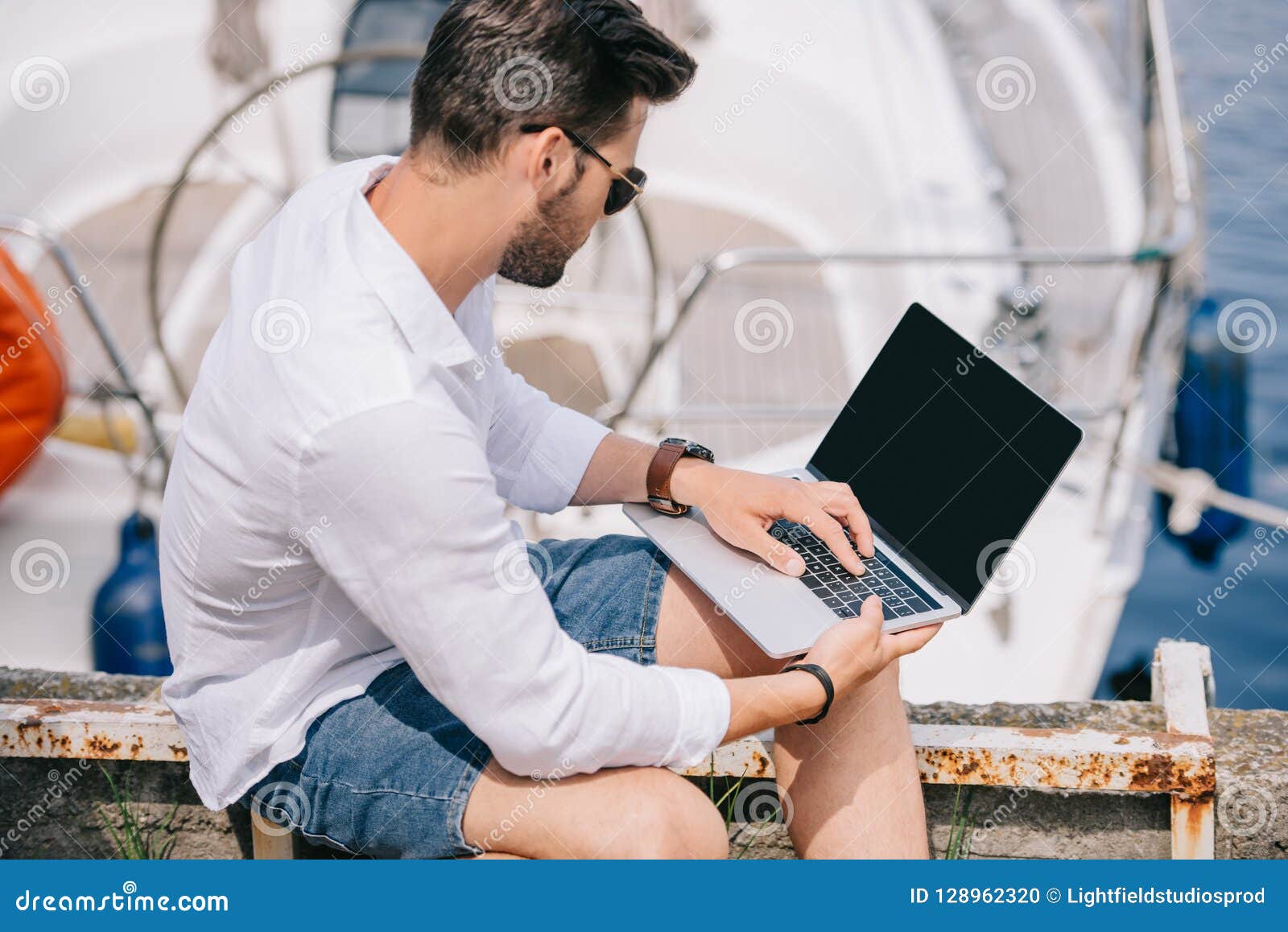 Young Man in Sunglasses Using Laptop with Blank Screen Stock Photo ...