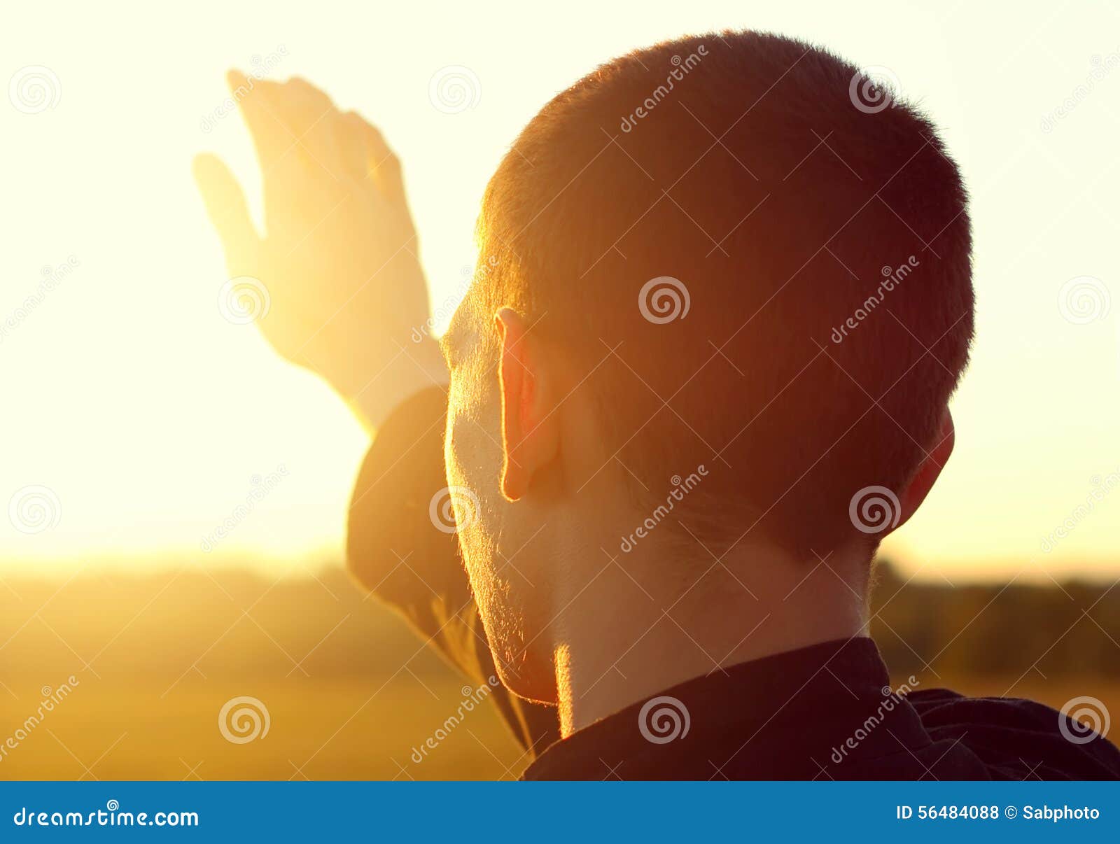 Young Man at Sunset stock photo. Image of enjoyment, dreamy - 56484088