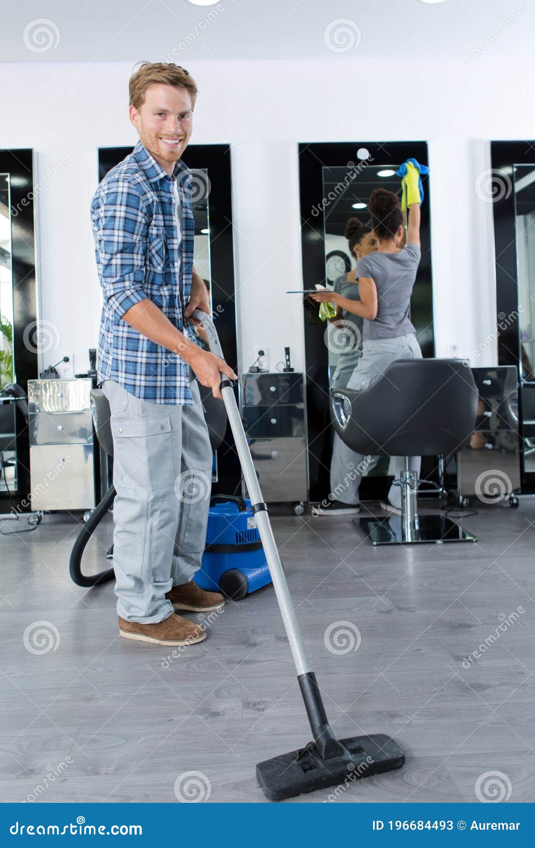 Young Man Sweeping Floor in Salon Stock Image - Image of business ...